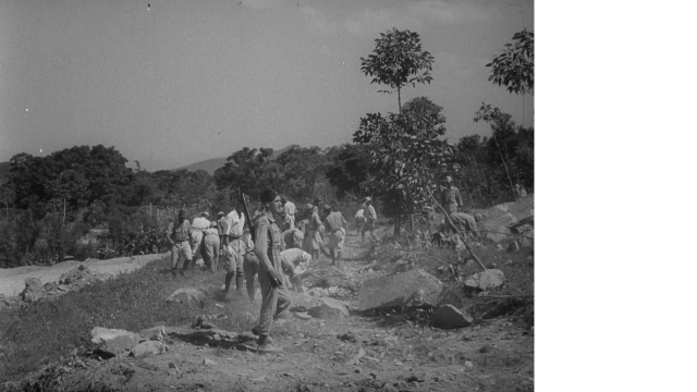 Japanese POWs cleaning up after the hillside was dynamited (1) | Gwulo